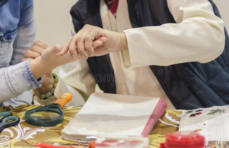 Astrologer-palmist Conducts a Study of the Hand of the Client and Makes ...