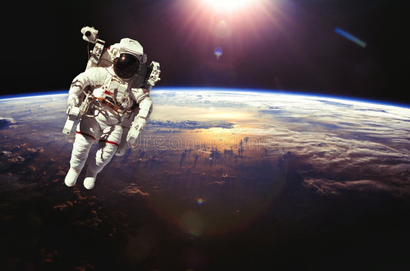 Astronaut in Outer Space Above the Earth during Sunset. Elements Stock ...