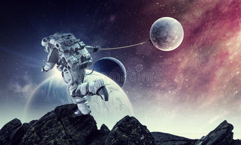 Fantasy Image with Spaceman Catch Planet. Mixed Media Stock Photo ...