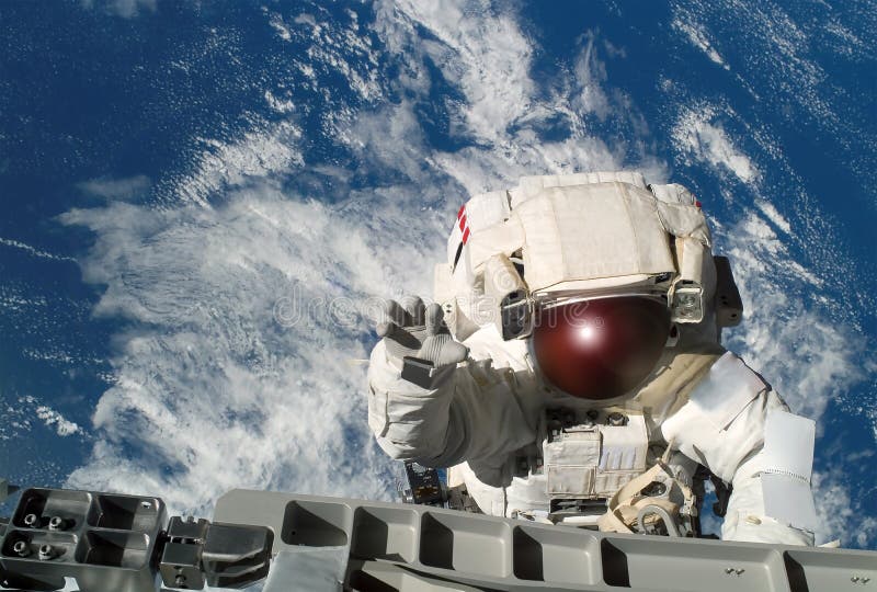 The Astronaut in a Space Suit, Waves a Hand, at the Space Station ...