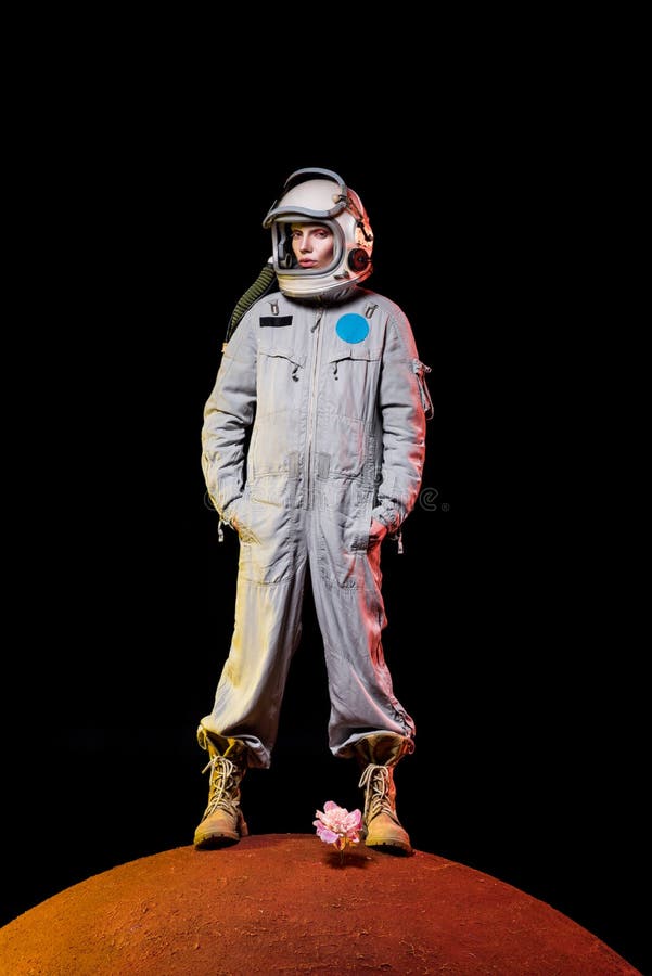 Stylish Astronaut in Spacesuit Holding Helmet Sitting on Planet Stock ... Stylish Astronaut in Spacesuit Holding Helmet Sitting on Planet Stock ...