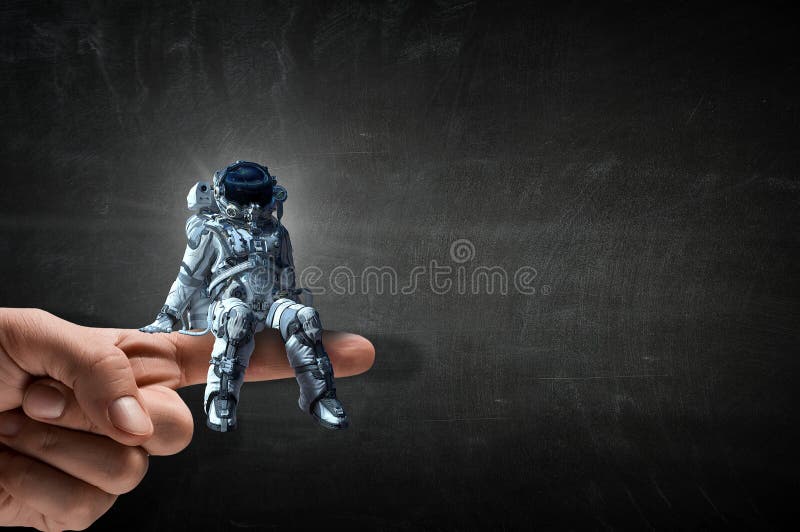 Spaceman on Finger. Mixed Media Stock Photo - Image of fiction, light ...