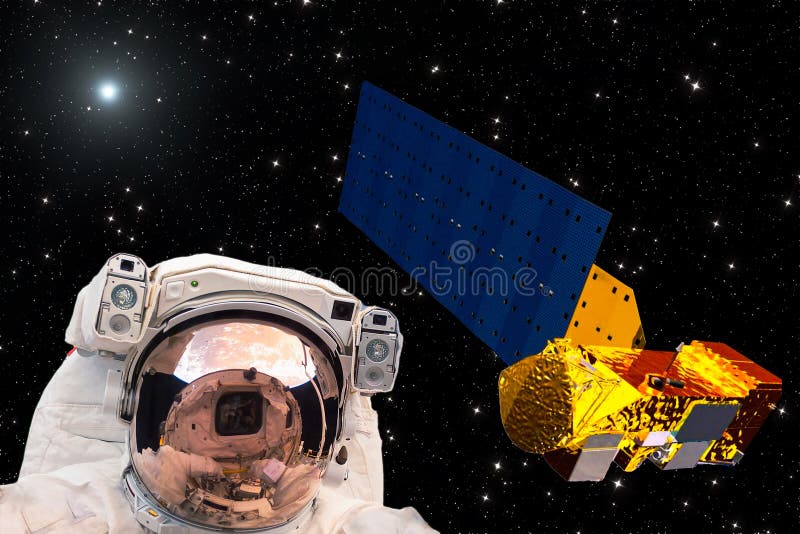 An Astronaut and a Wing of Solar Panels of a Space Station. the ...