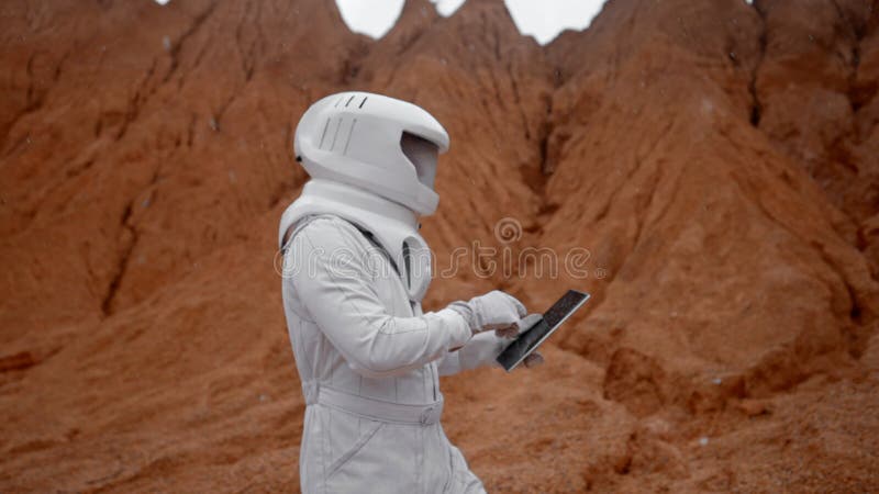 Astronaut Working with Digital Pad on the Mars Surface Stock Footage ...