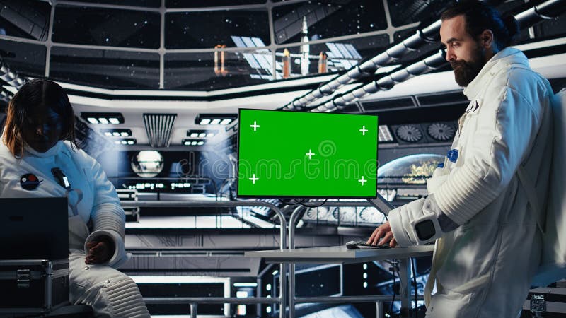 Astronauts in Advanced Technology Spacecraft Using Green Screen Monitor ...