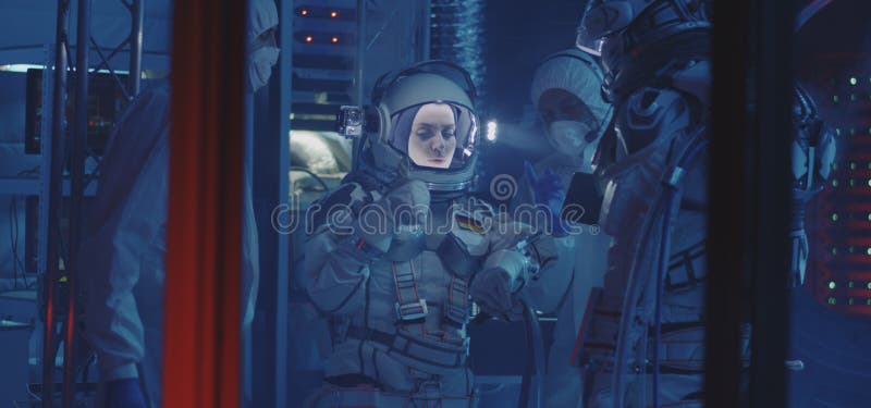 Astronauts Testing Spacesuit in Laboratory Stock Photo - Image of ...