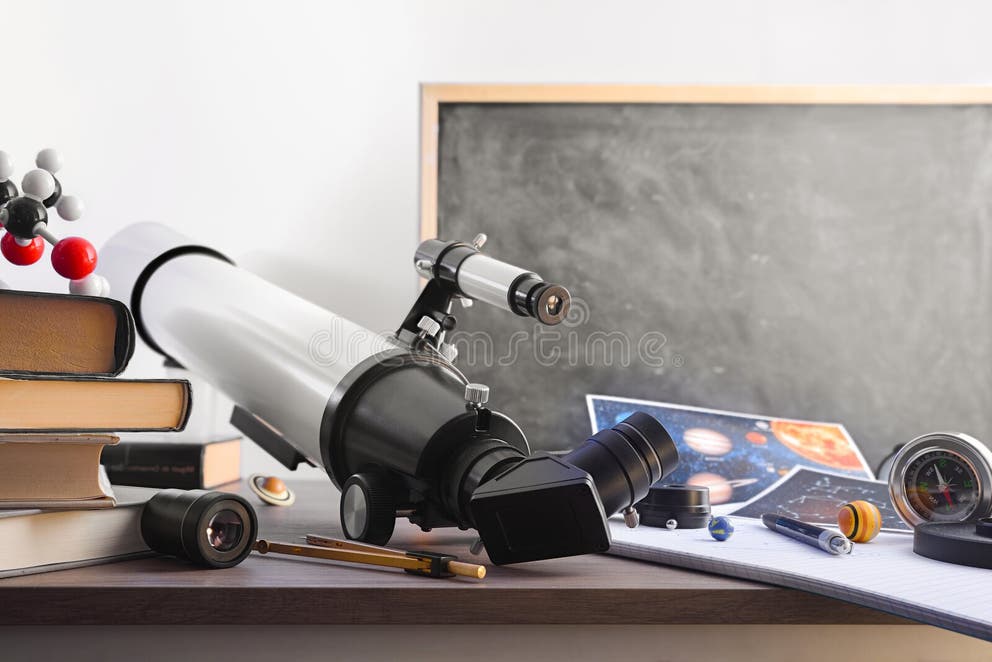 Astronomy Student Table with Tools and Blackboard in Background Stock ...