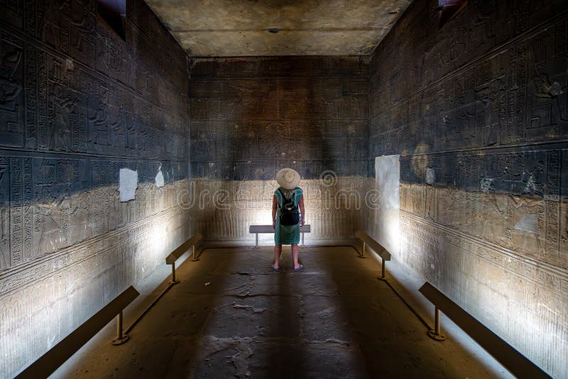 Aswan, Egypt - Person Examining Old Hieroglyphs Inside the Temple of ...