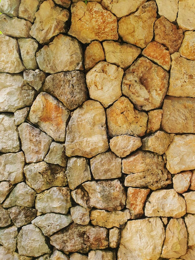 Asymmetric stone wall stock photo. Image of natural - 214357216