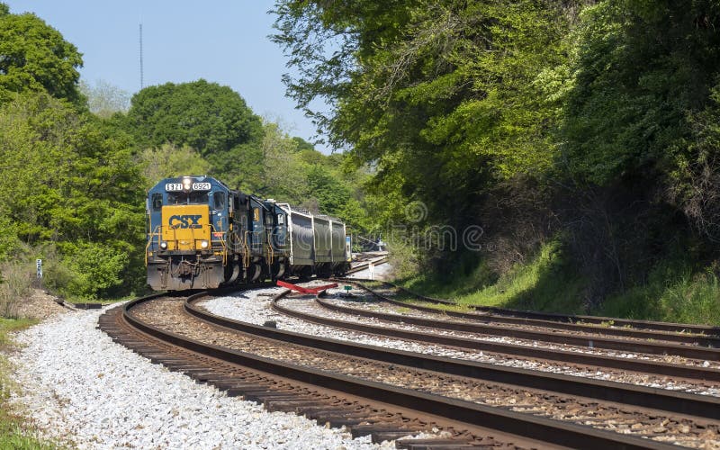CSX Engine 6921 Pulls a Small Load Around a Curve in the Railroad Track ...