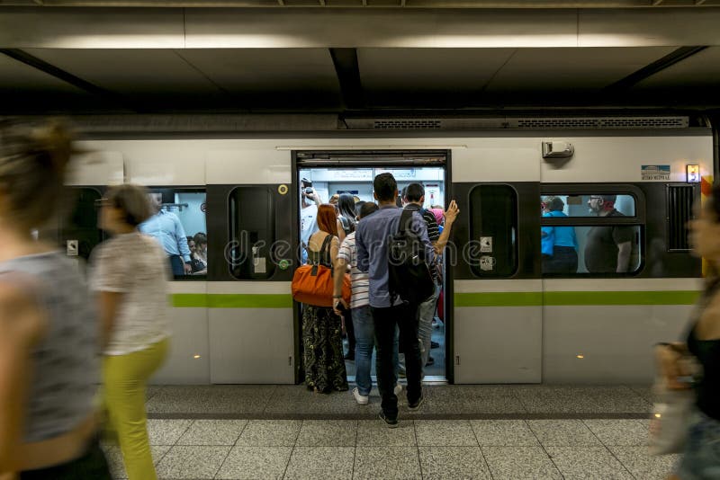 Passengers Board a Train at the Acropolis Metro Station Platform in ...