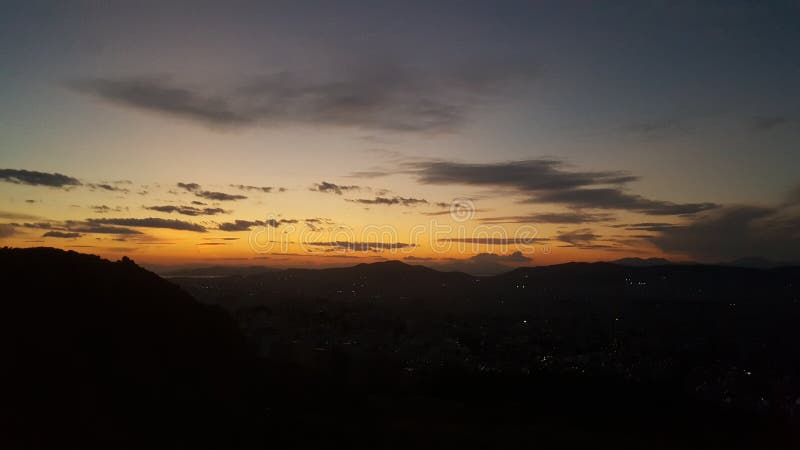 Sunset on the Hill Under the Orange. Stock Photo - Image of building ...
