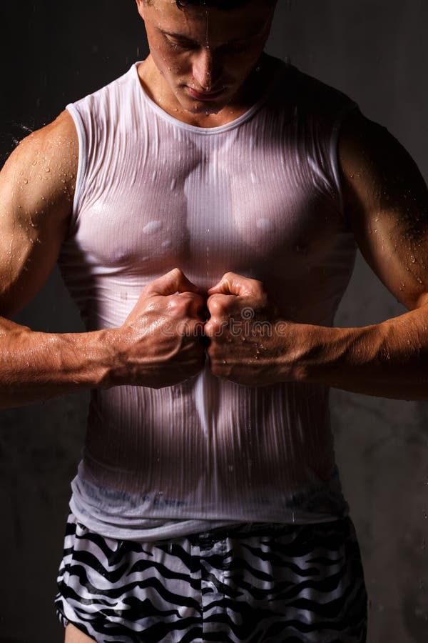 Athlete Bodybuilder Trains in the Studio in the Rain. Stock Photo ...