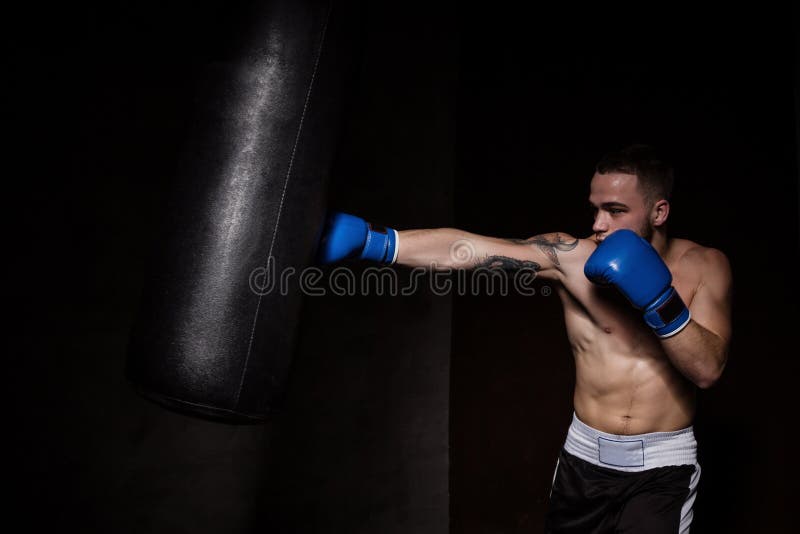 Athlete Boxer Man Punching a Punching Bag Stock Image - Image of ...