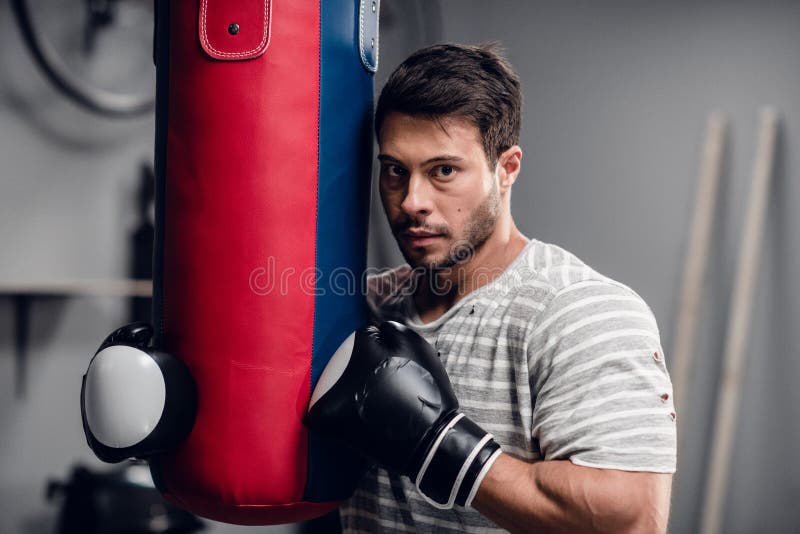 An Athlete Boxer Poses for a Photo Session in the Hall Where he is ...