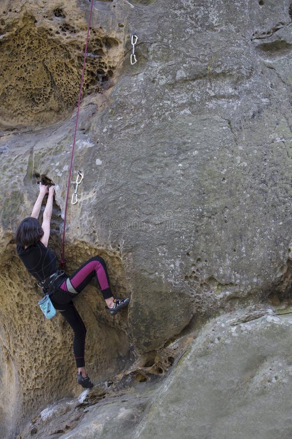 Athlete Climbs on Rock with Rope. Stock Photo - Image of clouds ...