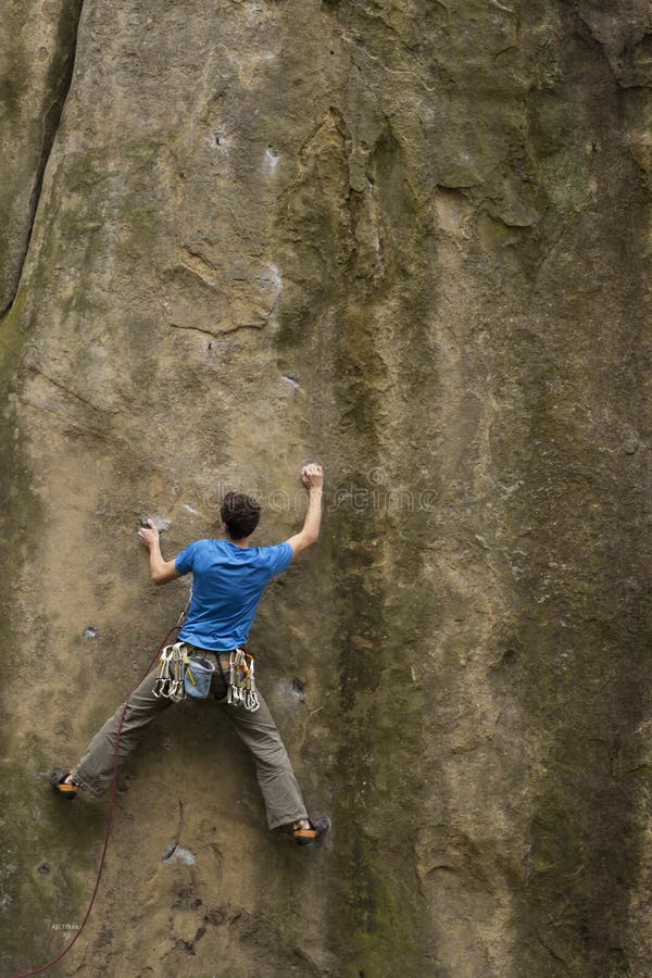 Athlete Climbs on Rock with Rope. Stock Photo - Image of athletic ...