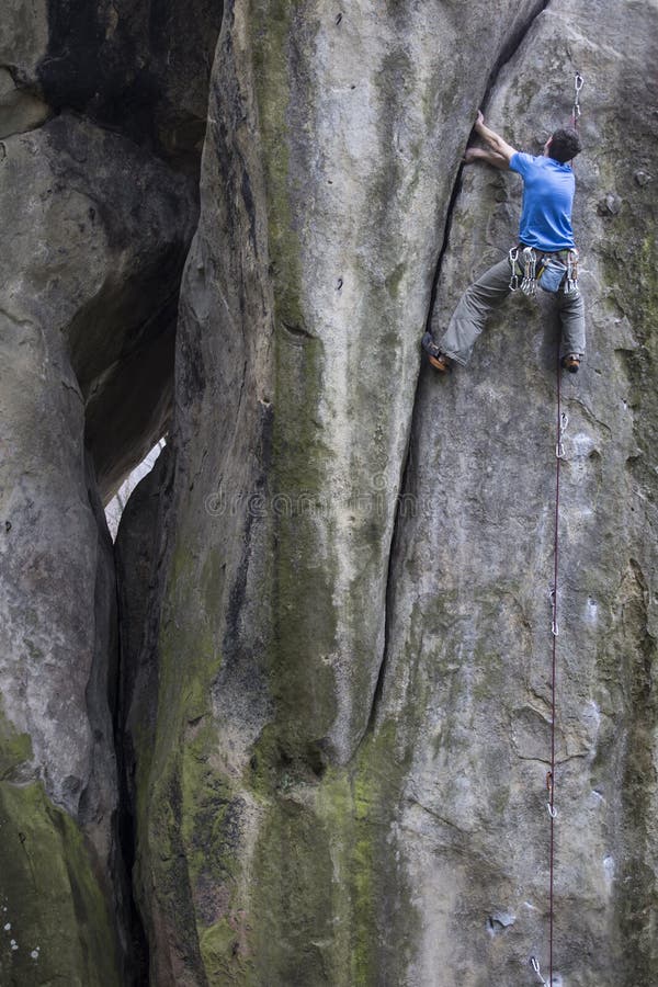 Athlete Climbs on Rock with Rope. Stock Photo - Image of alone ...