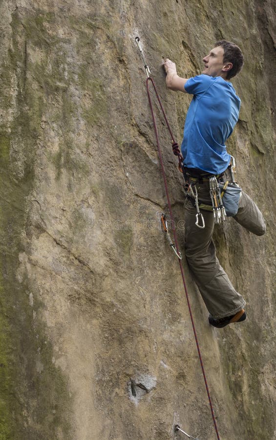 Athlete Climbs on Rock with Rope. Stock Photo - Image of athletic ...