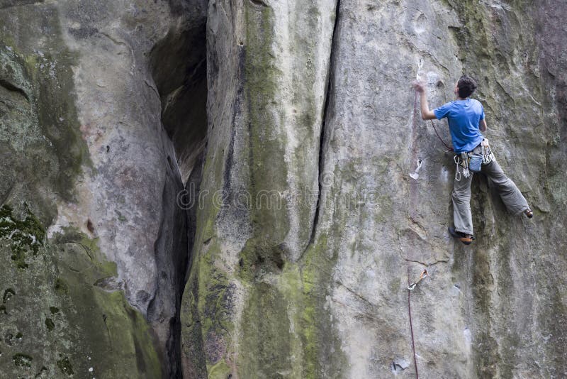 Athlete Climbs on Rock with Rope. Stock Photo - Image of balance ...