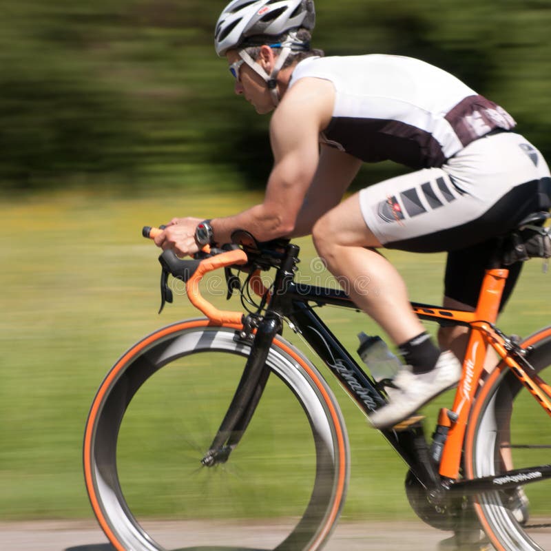 Cyclist Riding A Bike Uphill Stock Image - Image of racer, movement ...