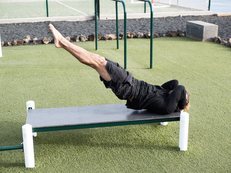 Athlete Doing Dragon Flag Abs Exercise Stock Photo - Image of strong ...