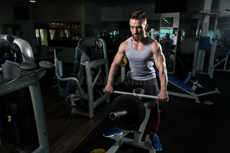 Athlete Doing Exercise for Back with Weights Stock Photo - Image of ...