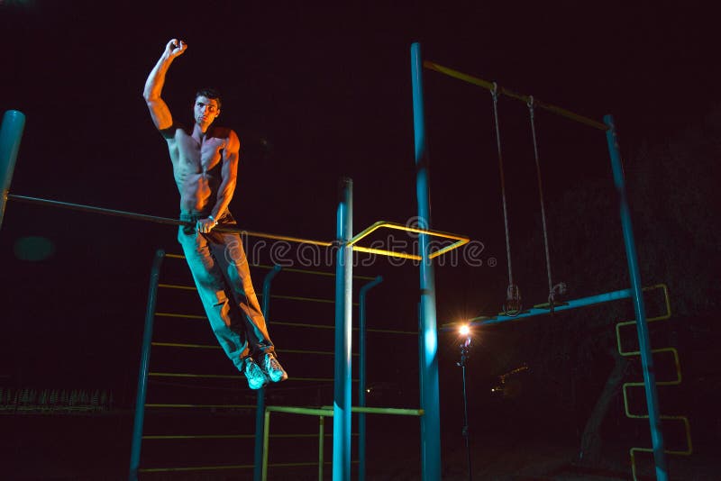 Athlete Doing Exercises on the Horizontal Bar Stock Image - Image of ...
