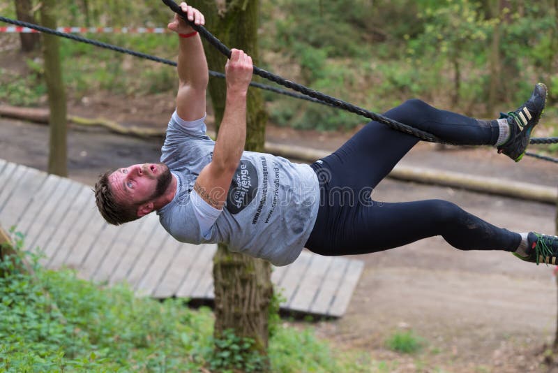 Athlete Doing a Survival Run Editorial Stock Image - Image of obstacle ...