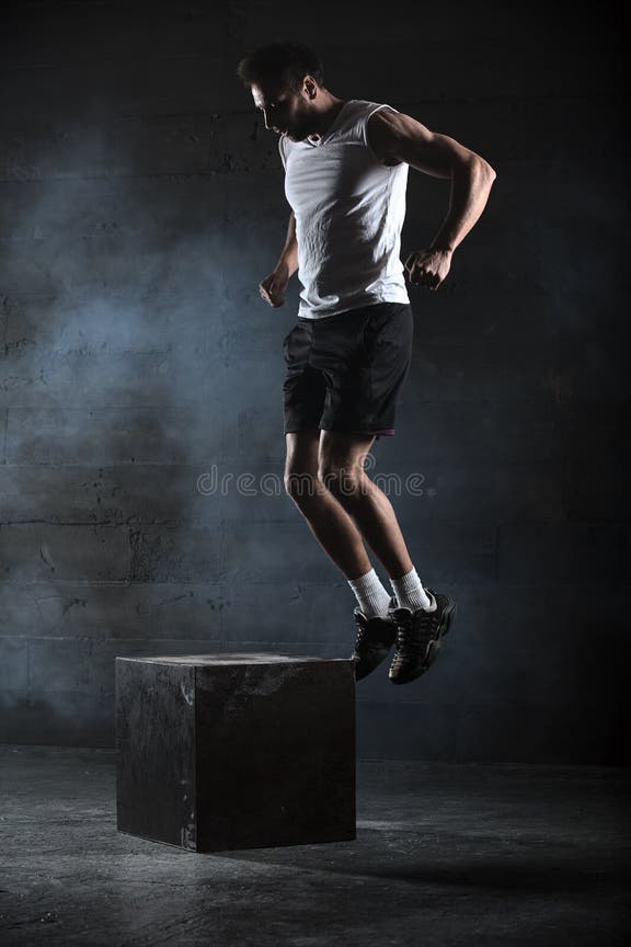 Athlete Gave Exercise. Jumping on the Box Stock Image - Image of ...