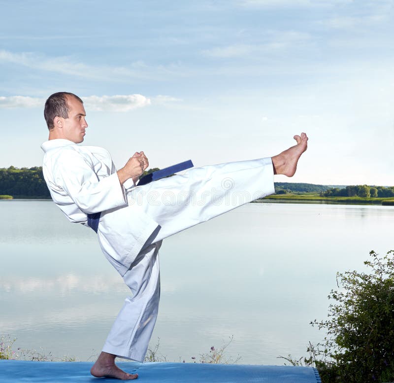 Athletes is Hitting a Kick Forward on the Lake Stock Image - Image of ...