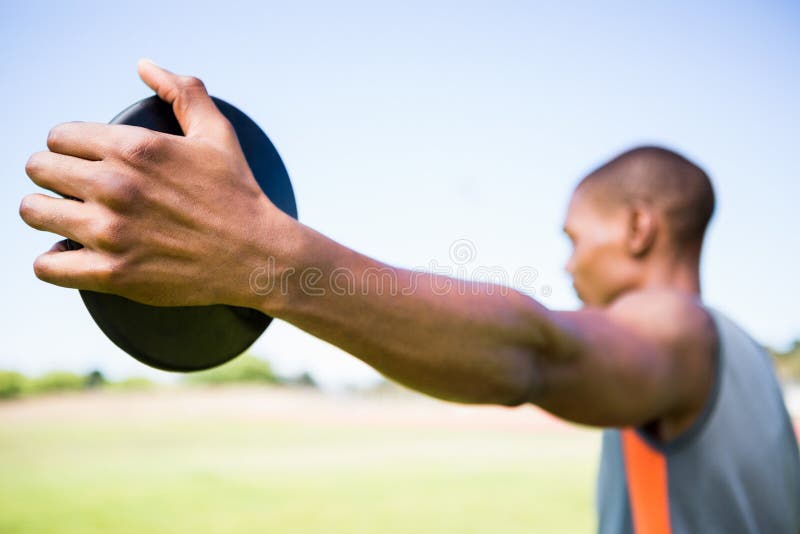 Athlete holding a discus stock photo. Image of outdoors - 74029874
