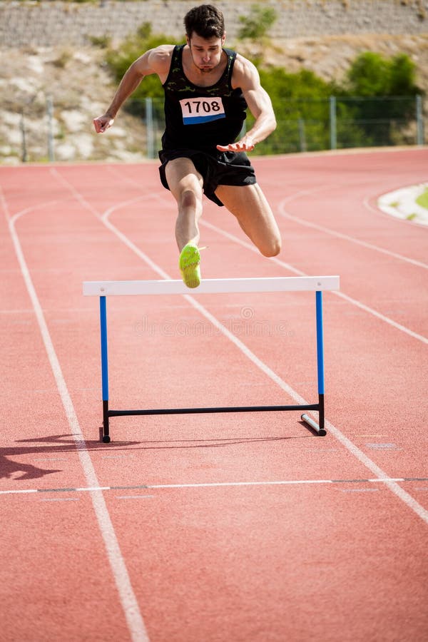 Athlete Jumping Above the Hurdle Stock Photo - Image of leaping ...