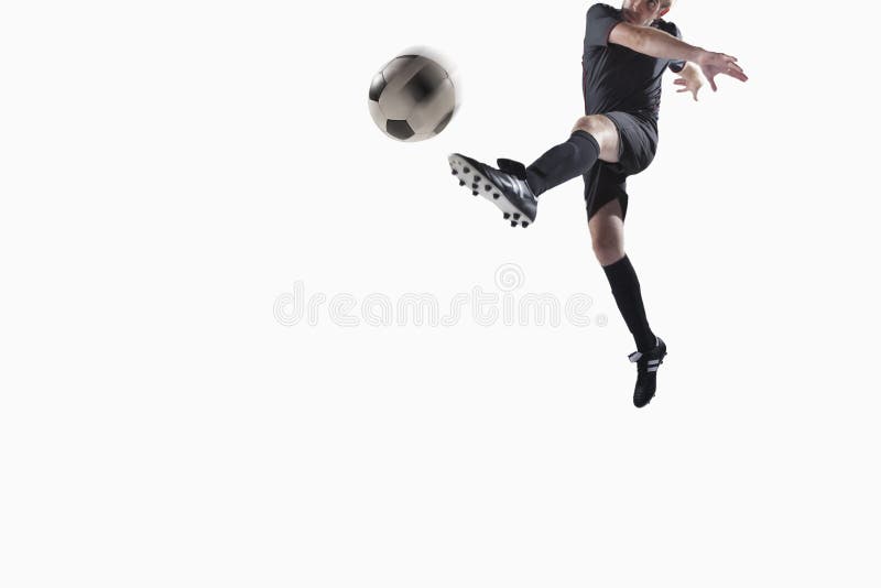 Athlete Kicking a Soccer Ball Stock Image - Image of caucasian, kicking ...