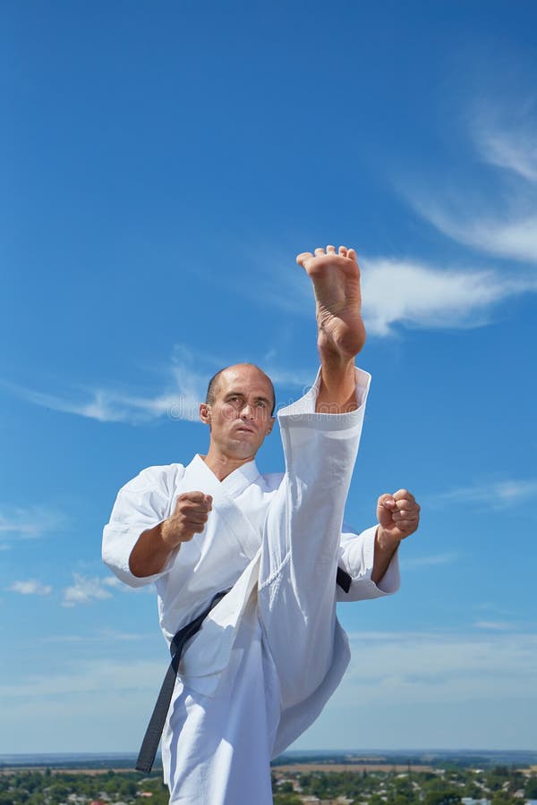 Active Athlete Kicks Kick Against Blue Sky Stock Photo - Image of ...