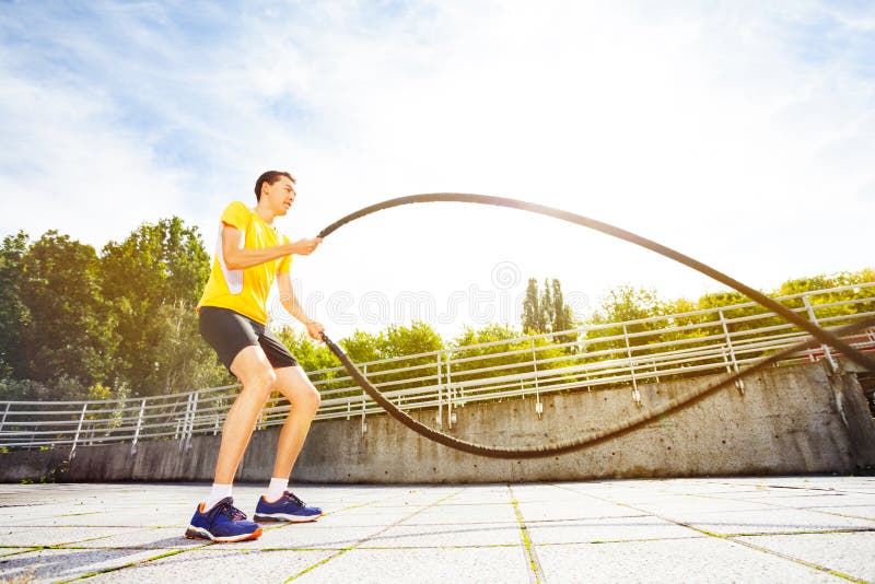 Athlete Making Wave Movement with Muscle Rope Stock Photo - Image of ...
