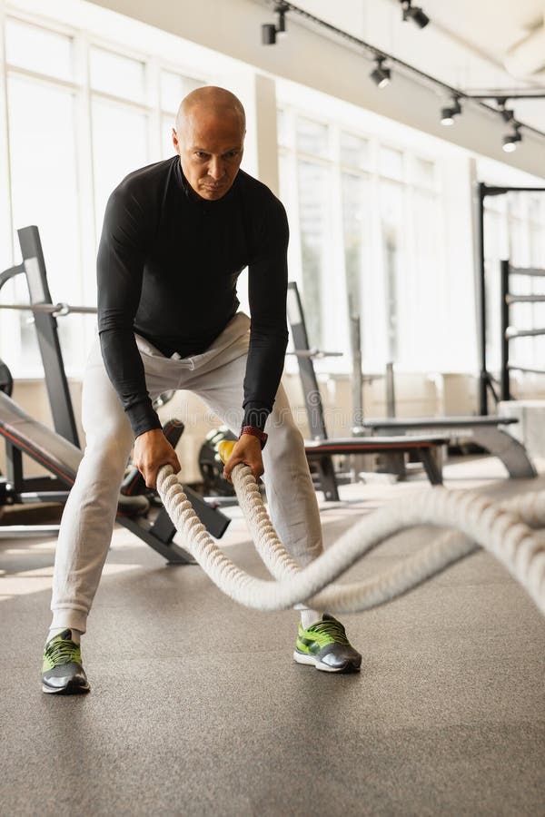 Athlete Man Make Battle Ropes Exercise at Gym Stock Image - Image of ...