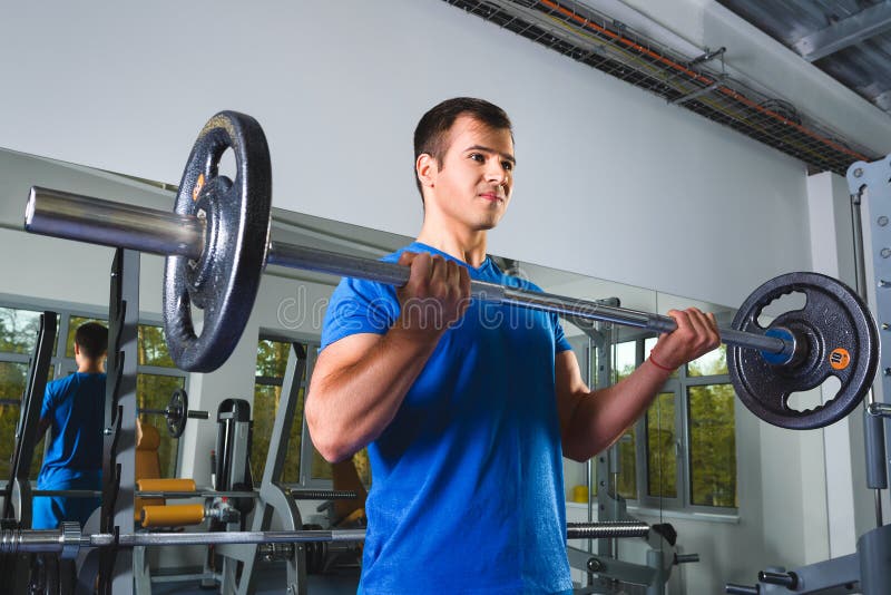 Athlete Muscular Bodybuilder in the Gym Training with Bar Stock Photo ...