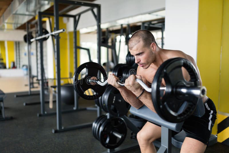 Athlete Muscular Bodybuilder in Gym Training Biceps Stock Photo - Image ...