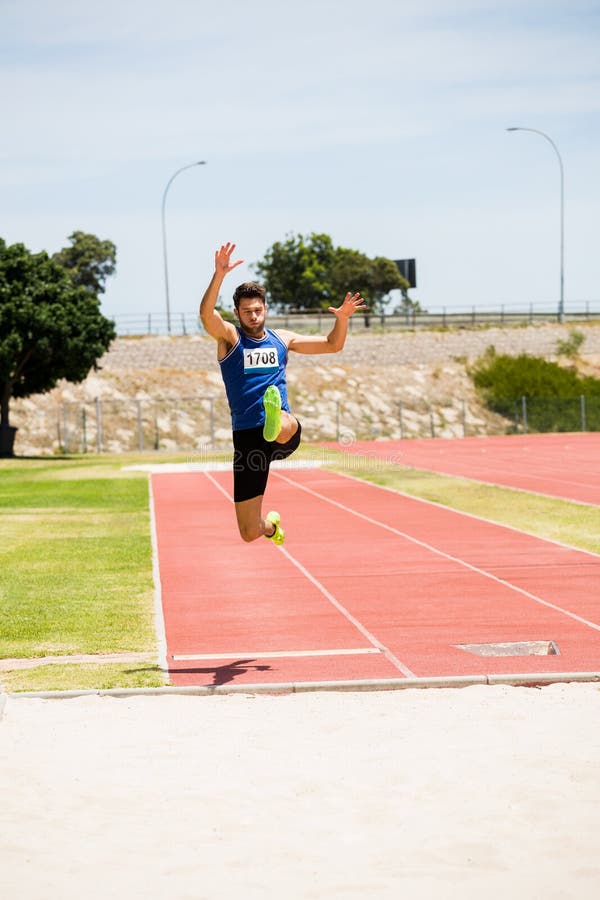 Athlete Performing a Long Jump Stock Photo - Image of speed, vitality ...