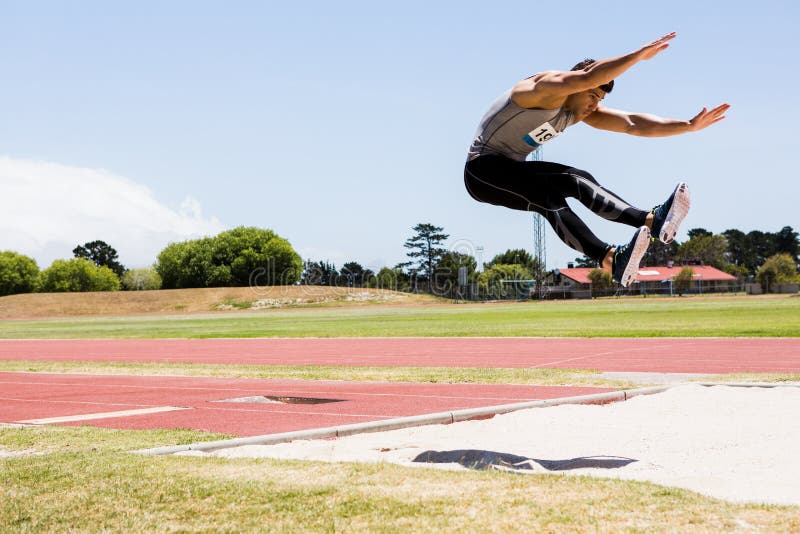 Athlete Performing a Long Jump Stock Image - Image of olympics ...