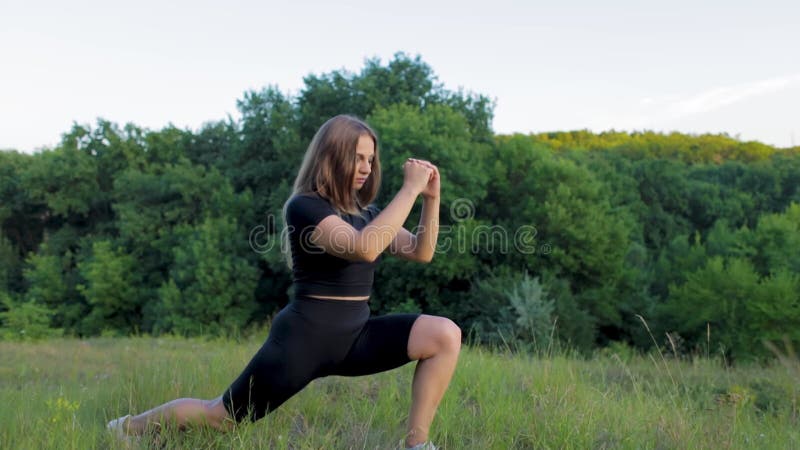 Athlete Performs Exercises for Stretching of the Respective Limbs on ... Athlete Performs Exercises for Stretching of the Respective Limbs on ...