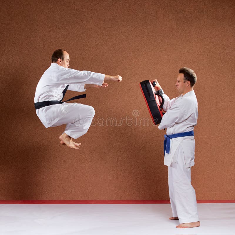 The Athlete Prepares To Kick His Foot in the Jump on the Simulator ...