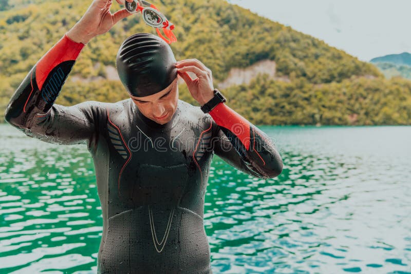 Athlete Putting on a Swimming Suit and Preparing for Triathlon Swimming ...