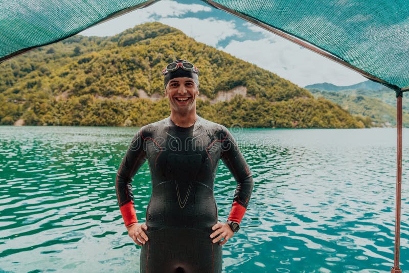 Athlete Putting on a Swimming Suit and Preparing for Triathlon Swimming ...