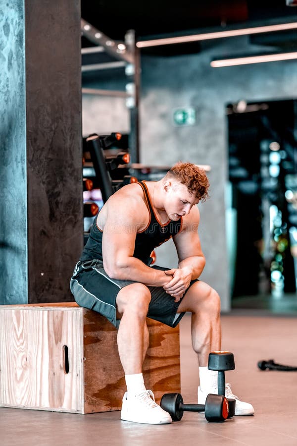 Athlete Resting in the Gym between Exercises Stock Photo - Image of ... Athlete Resting in the Gym between Exercises Stock Photo - Image of ...