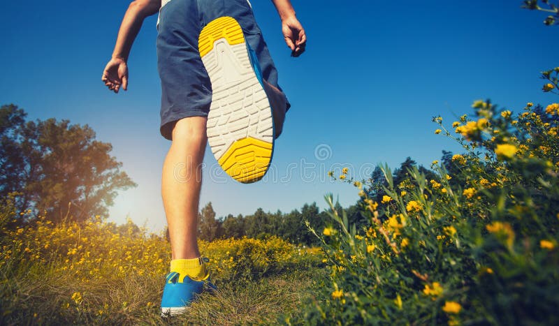 Athlete Running through the Meadow. Stock Image - Image of sportsman ...