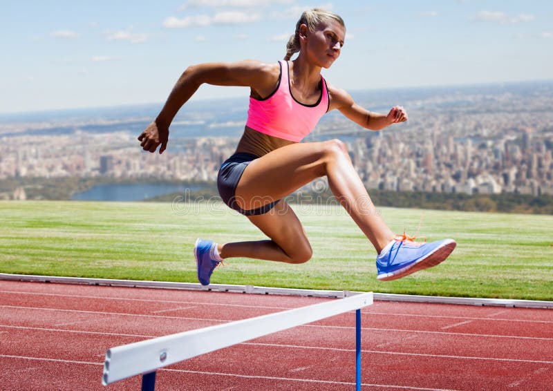 Female Athlete Jumping Over Hurdle on Race Track Stock Image - Image of ...