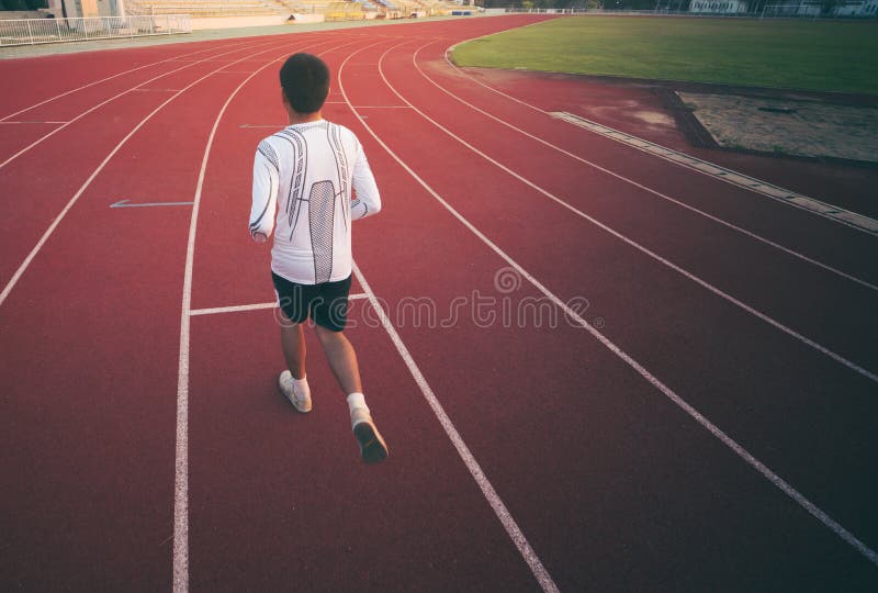 Athlete Runs Around Stadium Stock Photos - Free & Royalty-Free Stock ...