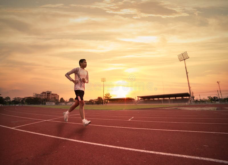 Athlete Runs Around Stadium Stock Photos - Free & Royalty-Free Stock ...